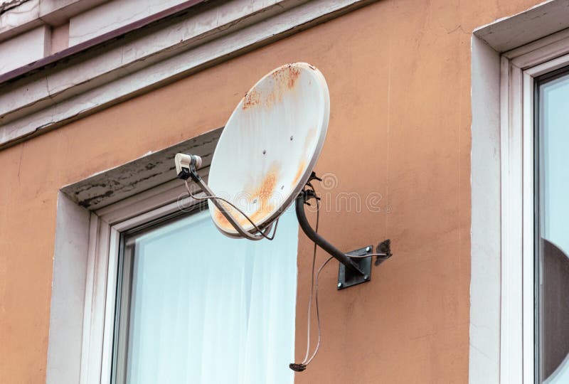 Rusty Satellite Dish on the Wall of the House Stock Photo - Image of ...