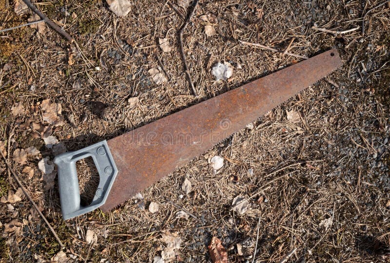 Rusty Saw Lying on the Ground Outdoors Stock Image - Image of rough ...