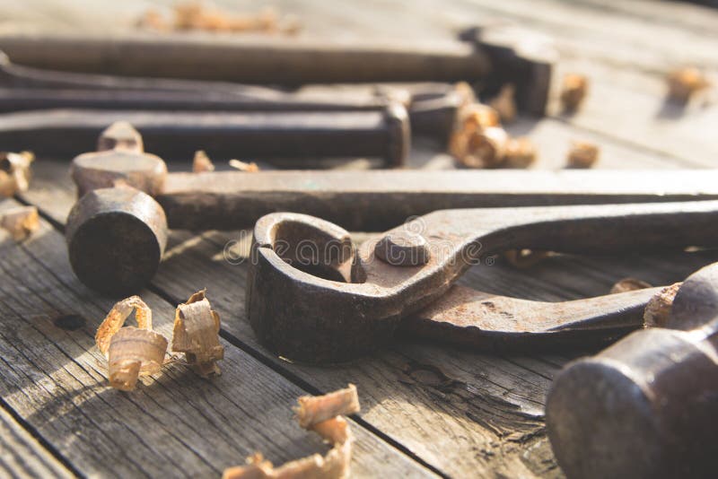 Rusty Set of Hand Tools on a Wooden Background. Vintage Photo Stock ...