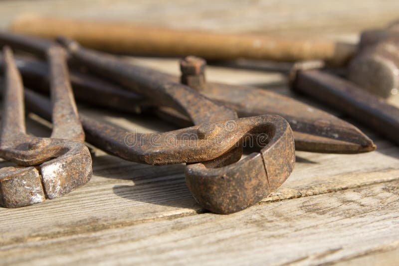 Rusty Set of Hand Tools on a Wooden Background. Vintage Photo Stock ...