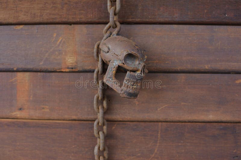 Rusty Skull with Rust Chain Hang on the Wood Wall Stock Photo - Image ...