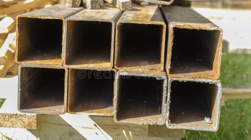 Rusty Square Pipes on a Construction Site Stock Photo - Image of iron ...