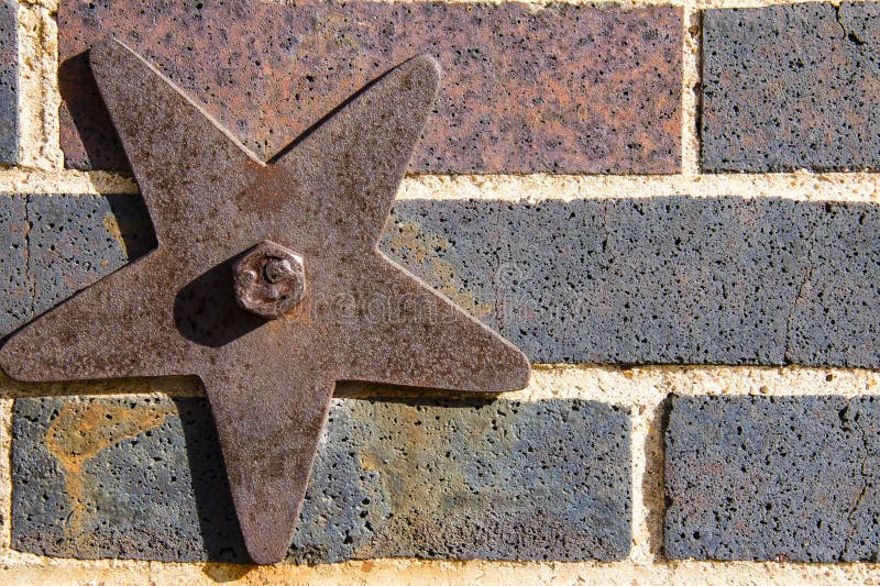 Rusty star on brick wall stock image. Image of textured - 40166445