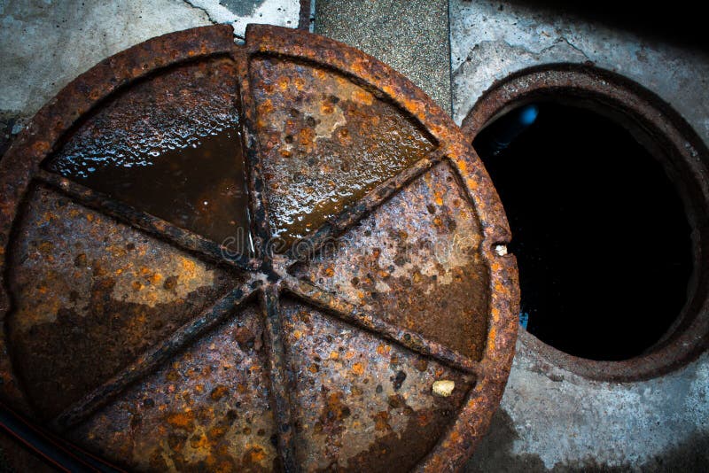 Rusty steel manhole cover stock image. Image of iron - 17286405