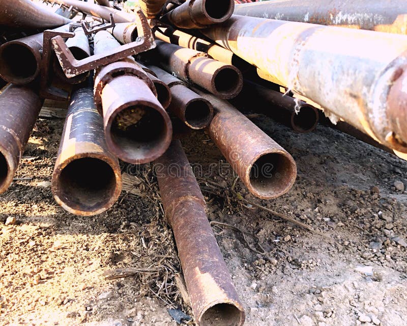 Pile of rusty pipes stock image. Image of industrial - 96202719
