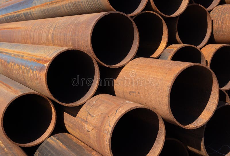 Rusty Steel Pipes Stacked on a Construction Site Stock Photo - Image of ...