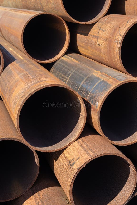 Rusty Steel Pipes Stacked on a Construction Site Stock Photo - Image of ...
