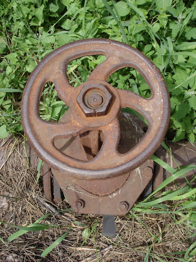 Rusty Steel Water Tap in the Green and Dry Grass Stock Image - Image of ...