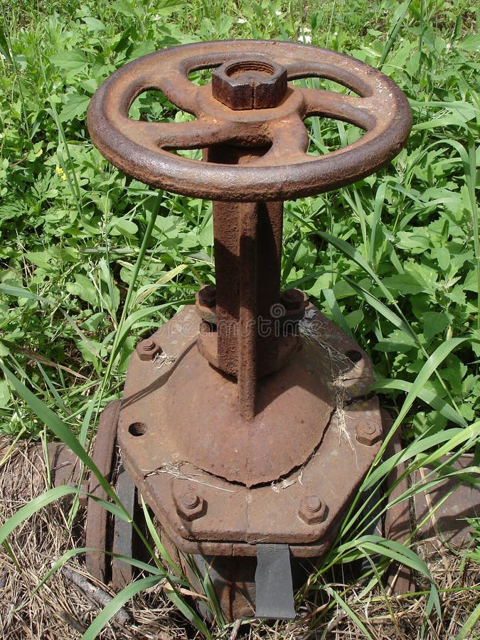 Rusty Steel Water Tap in the Green and Dry Grass Stock Photo - Image of ...