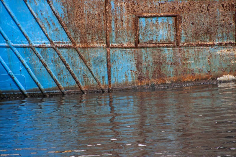 Rusty Structure on a Blue Abandoned Ship Hull in a Harbor Stock Image ...
