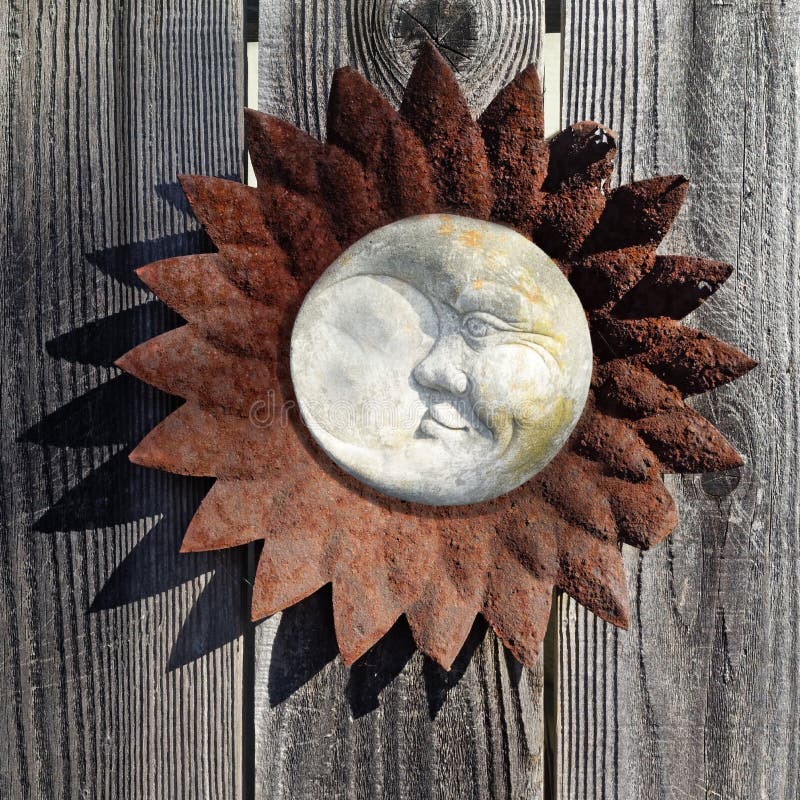 Rusty Sunburst and Moon Decoration Stock Photo - Image of face, symbol ...