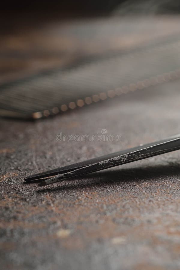 On a Rusty Surface Hairdressing Scissors and Comb. Close Up. Rustic ...
