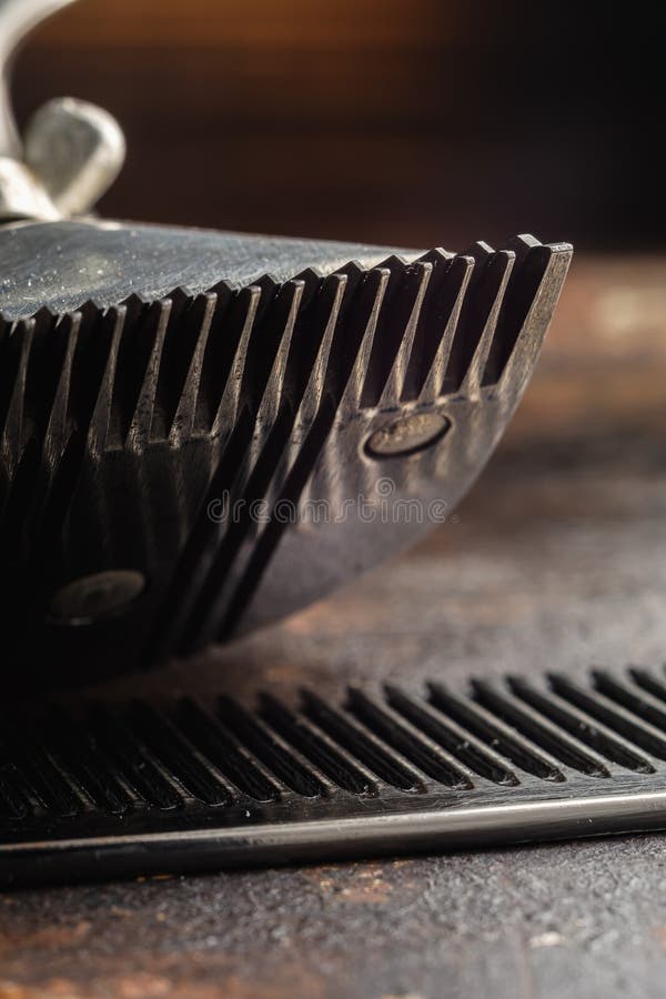 On a Rusty Surface Manual Clipper and Comb. Close Up. Rustic Stock ...