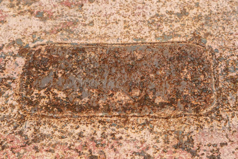 Rusty Thick Metal Surface with Paint Residue and a Rectangular Welded ...