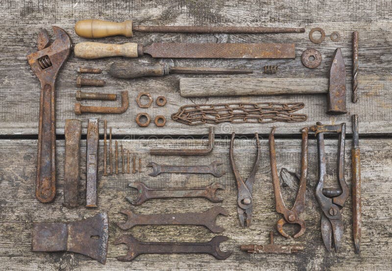 Rusty Tools Lie on Old Gray Boards Stock Image - Image of iron, frame ...