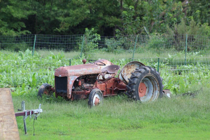 Rusty Tractor by the Garden Stock Photo - Image of rusty, garden: 126216574