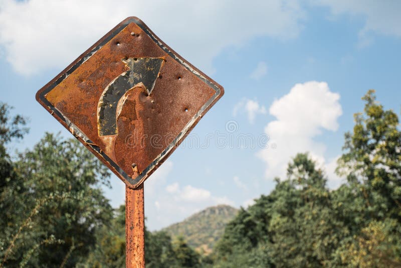 Rusty traffic warning sign stock photo. Image of rocks - 14400380