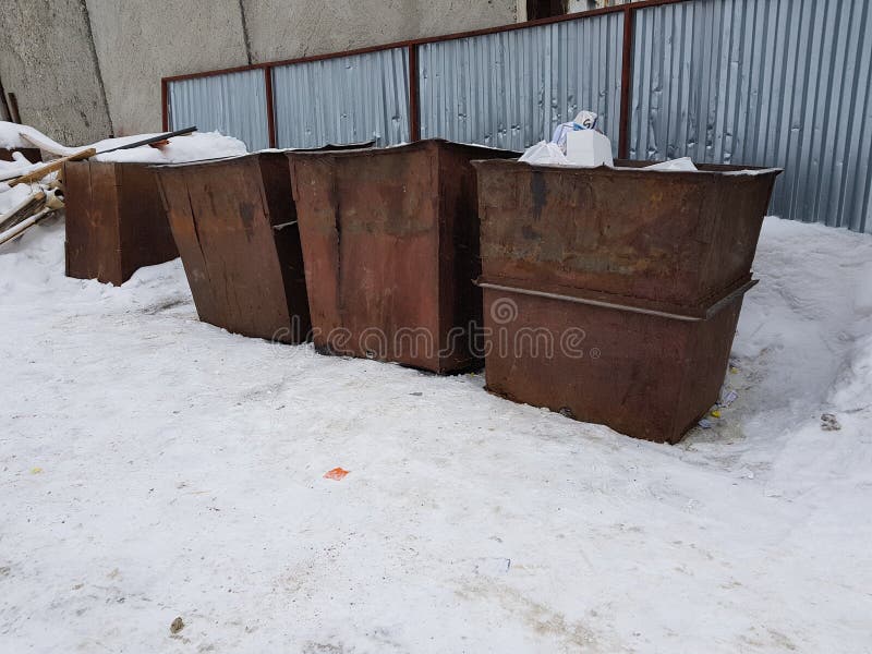 Rusty Trash Cans on the Snow in Winter Stock Photo - Image of ...