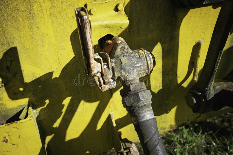 A Rusty Valve is Attached To a Yellow Pipe Stock Photo - Image of ...