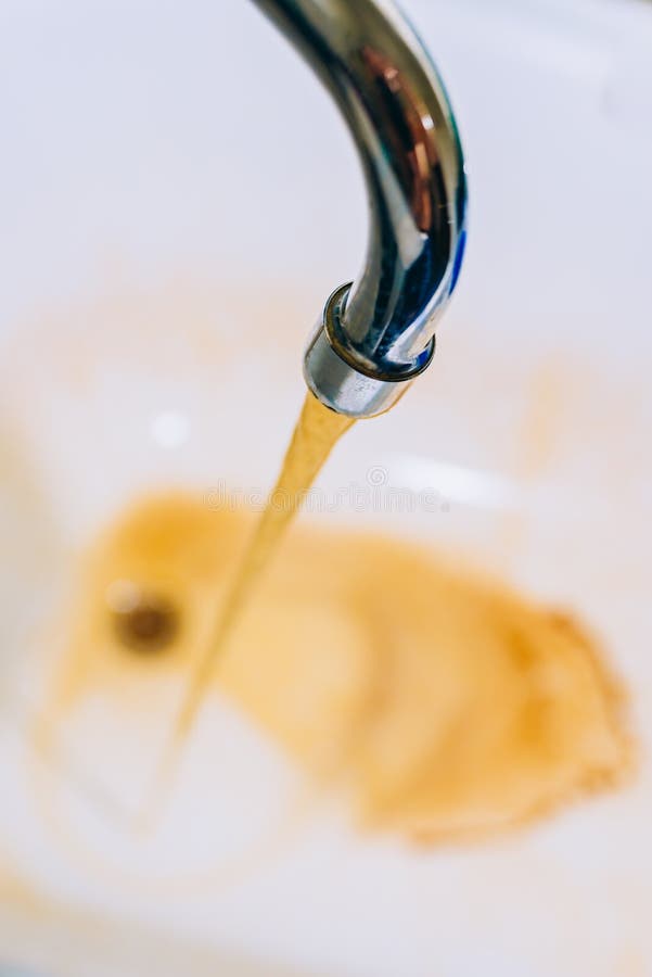 Rusty Water Flows from the Faucet in the Bathroom Stock Photo - Image ...