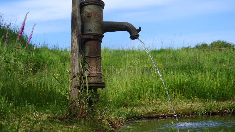 Rusty Water Fountain is Spraying Water into the Air. the Water is Clear ...
