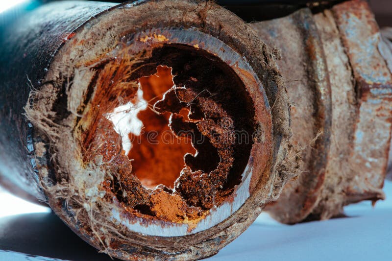 Rusty water pipe in a cut stock photo. Image of iron - 276108324