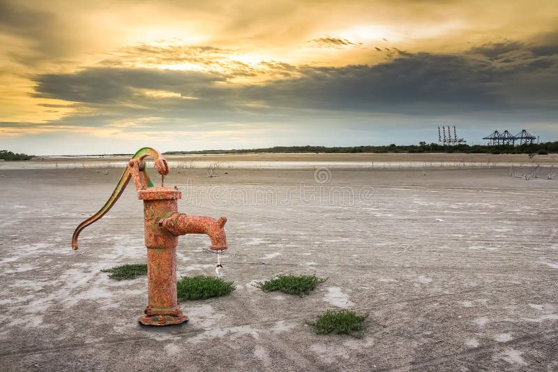 Rusty water pump on land. stock photo. Image of damaged - 70648236