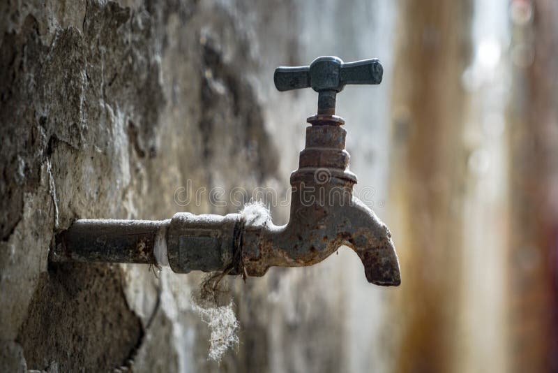 An Old Damaged Faucet with Rust Scratches and Peeling Chrome. Concept ...