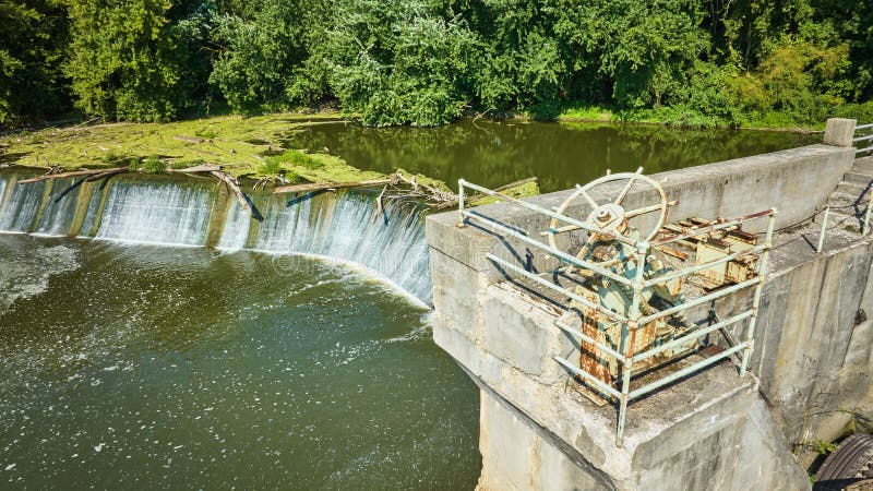 Rusty Wheel Maumee River Dam with Logs and Algae Growth Above Waterfall ...