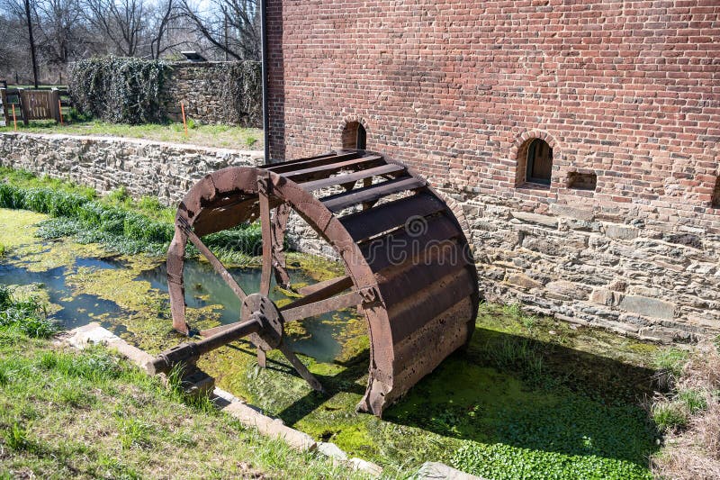 The Rusty Wheel of an Old Water Mill Stock Photo - Image of milling ...
