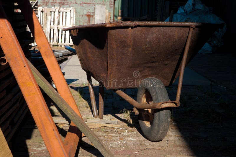 Rusty wheelbarrow stock photo. Image of vintage, carry - 17174242