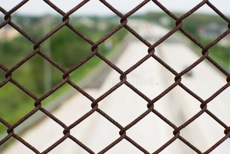 A Wire-mesh Parapet Below Which There is a Highway Stock Image - Image ...