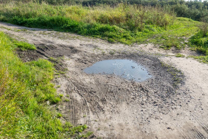 Ruts in the Roads Filled with Water Stock Photo - Image of road, dirt ...