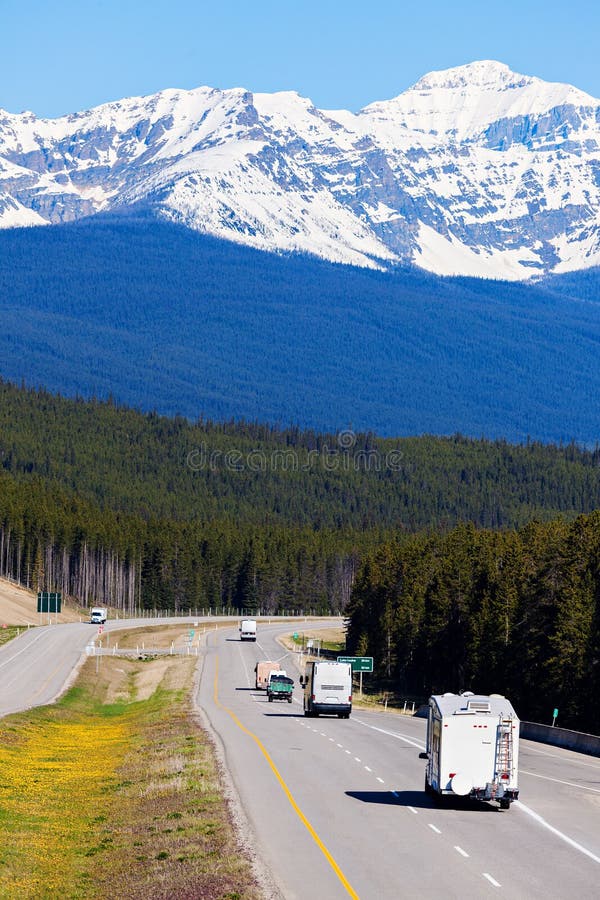 RV and Buses on the Road in Banff National Park Stock Image - Image of ...