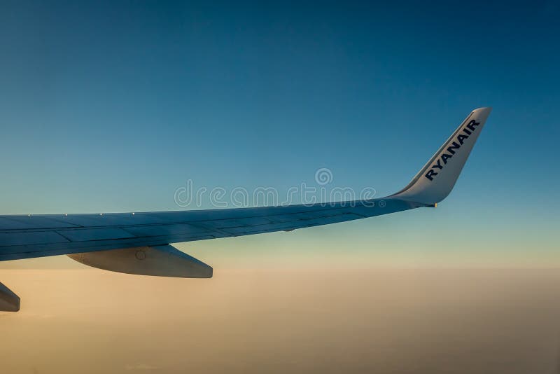 Ryanair wing at sunset editorial photography. Image of airliner - 44774127