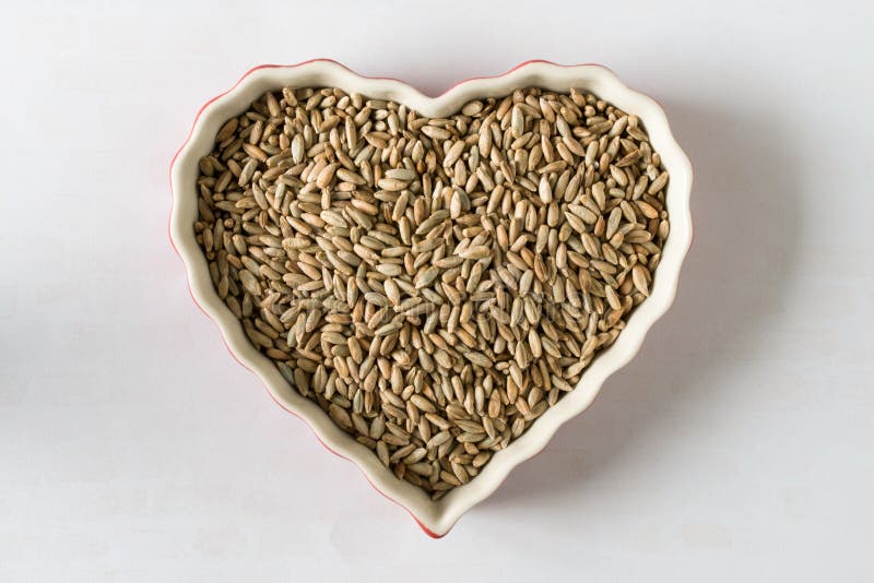 Uncooked Rye Berries in a Heart Shape Stock Photo - Image of milling ...
