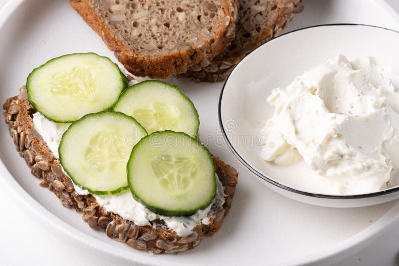 Rye Bread with Cream Cheese and Cucumbers on a White Table. Whole Grain ...