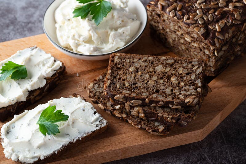 Rye Bread with Cream Cheese on Grey Table. Whole Grain Rye Bread with ...