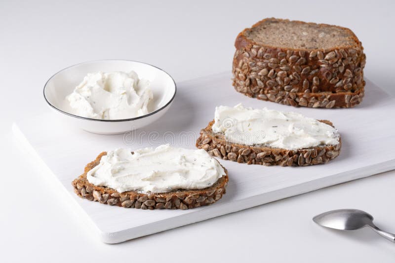 Rye Bread with Cream Cheese on White Table. Whole Grain Rye Bread with ...
