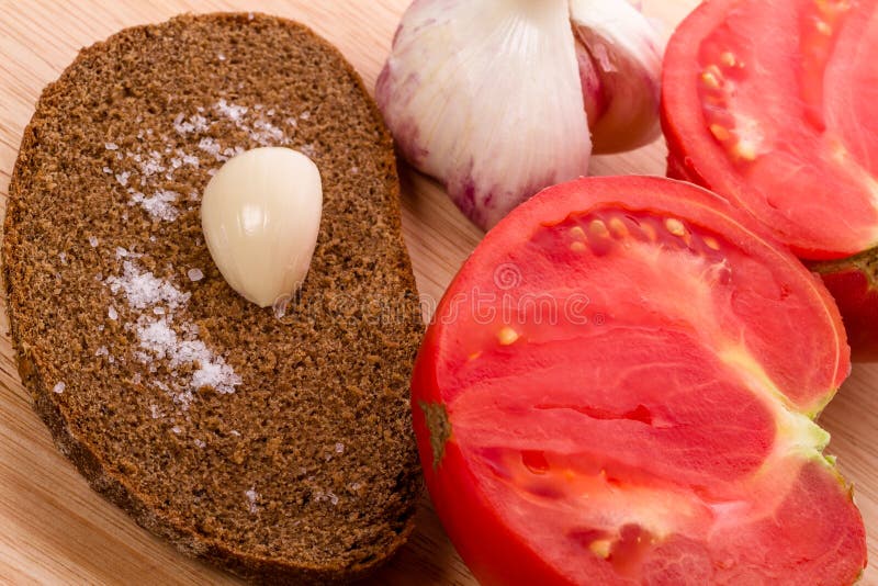 Rye Bread with Garlic and Tomato Stock Photo - Image of ripe, gourmet ...