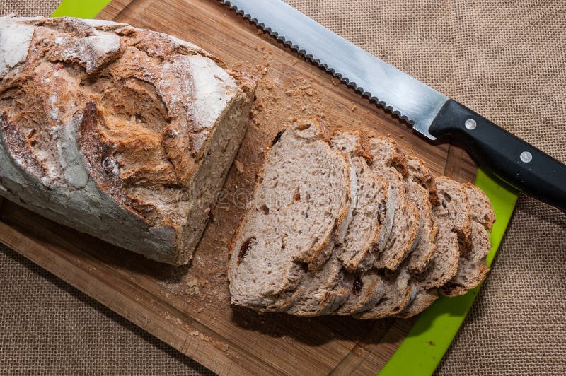 Rye Bread and Raisins on a Table Stock Photo - Image of knife ...
