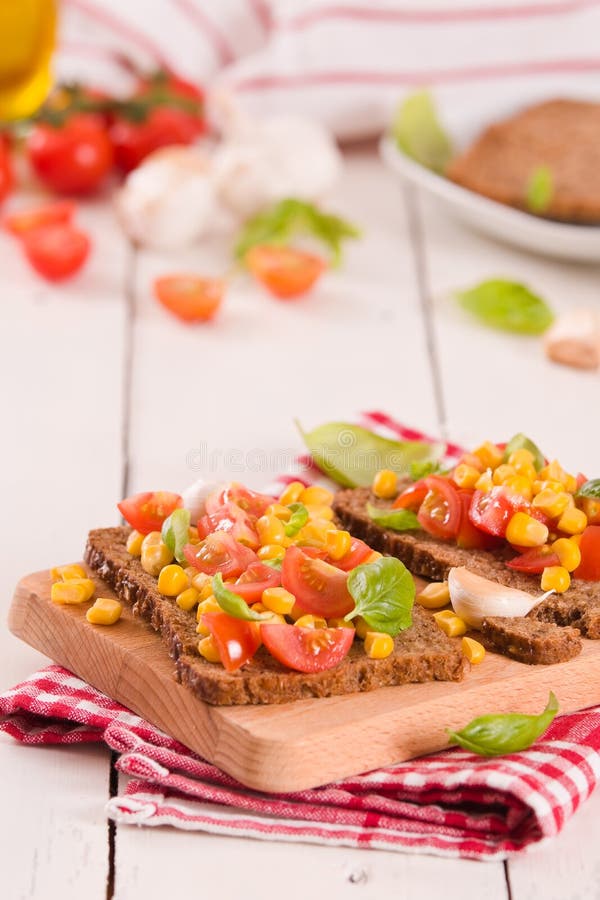 Rye Bread Withsweet Corn, Basil and Tomato. Stock Photo - Image of ...