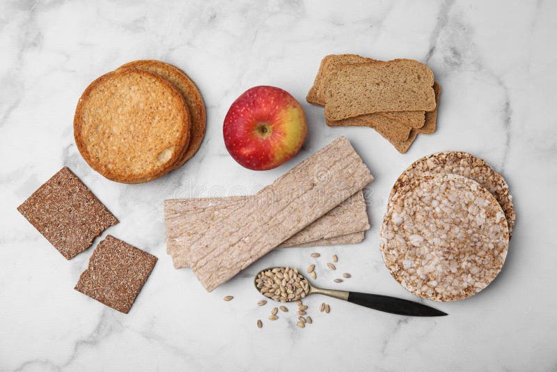 Rye Crispbreads, Rice Cakes and Rusks on White Marble Table, Flat Lay ...