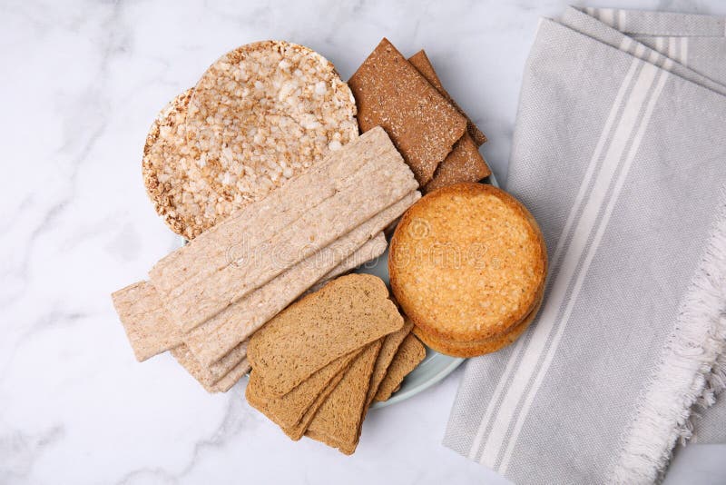 Rye Crispbreads, Rice Cakes and Rusks on White Marble Table, Flat Lay ...
