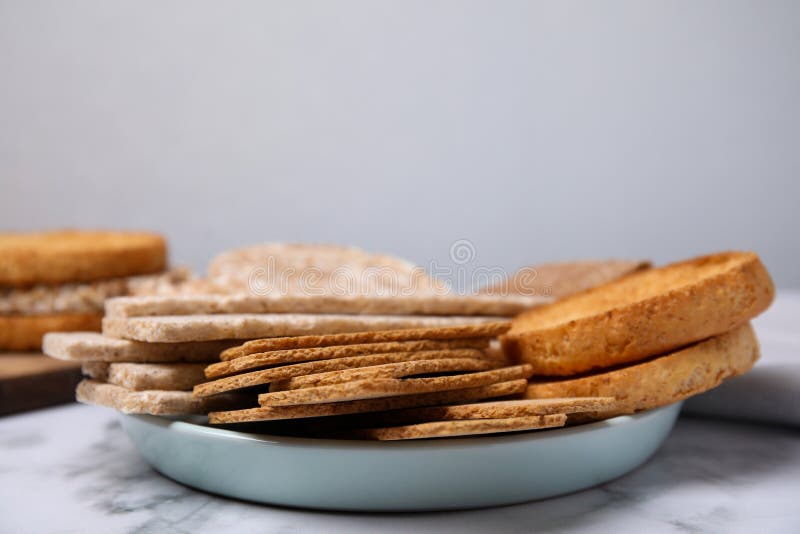 Rye Crispbreads, Rice Cakes and Rusks on White Marble Table, Space for ...
