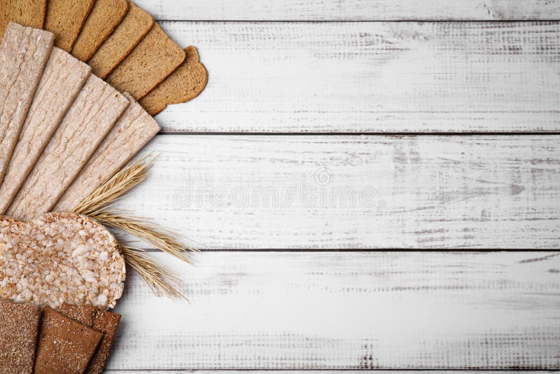 Rye Crispbreads, Rice Cakes and Rusks on White Wooden Table, Flat Lay ...