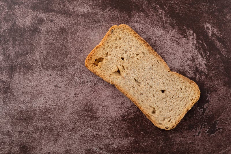Rye Melba Toast Slice on a Maroon Background Stock Image - Image of ...