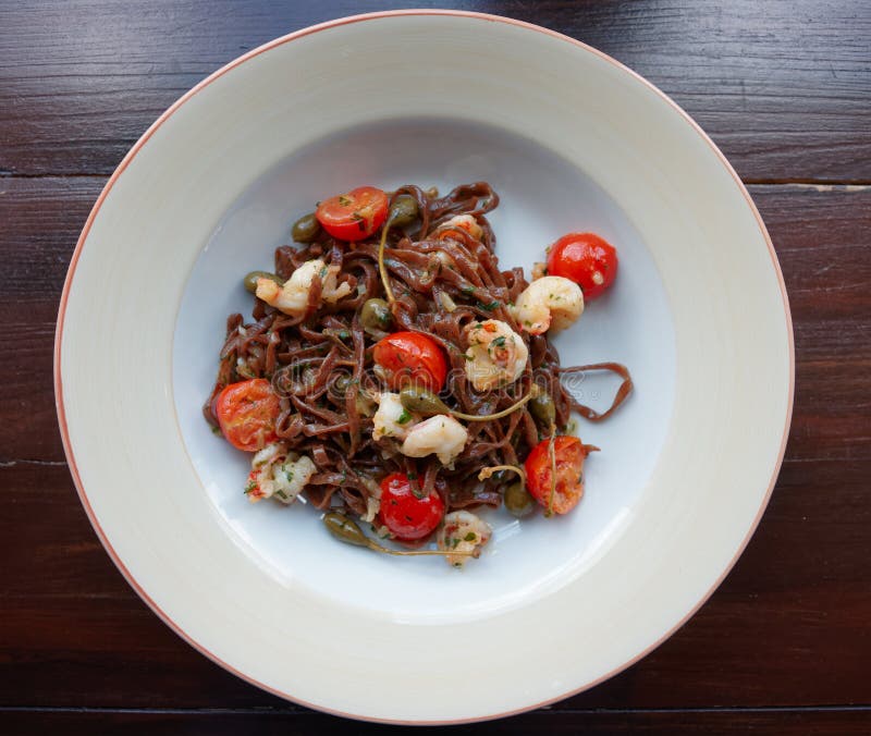 Rye Pasta with Capers and Prawns Stock Photo - Image of capers, food ...