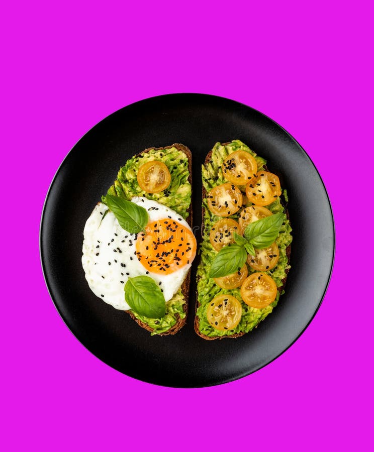 Rye Toast with Mashed Avocado and Poached Egg on on Black Plate on ...