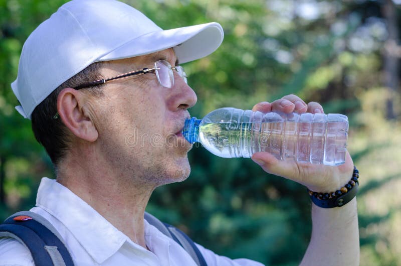 The 50s Age Man is Drinking Water Stock Photo - Image of pensioner ...